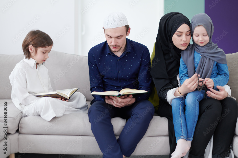 muslim family reading Quran and praying at home Stock Photo | Adobe Stock