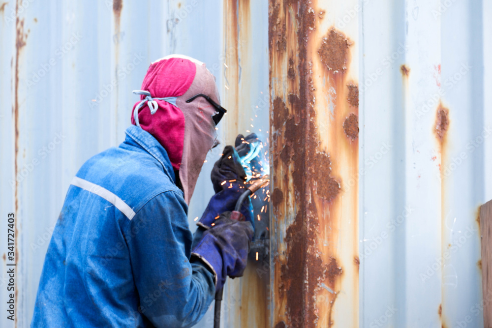 Container Welder and Repair Damage from packing Stock Photo | Adobe Stock