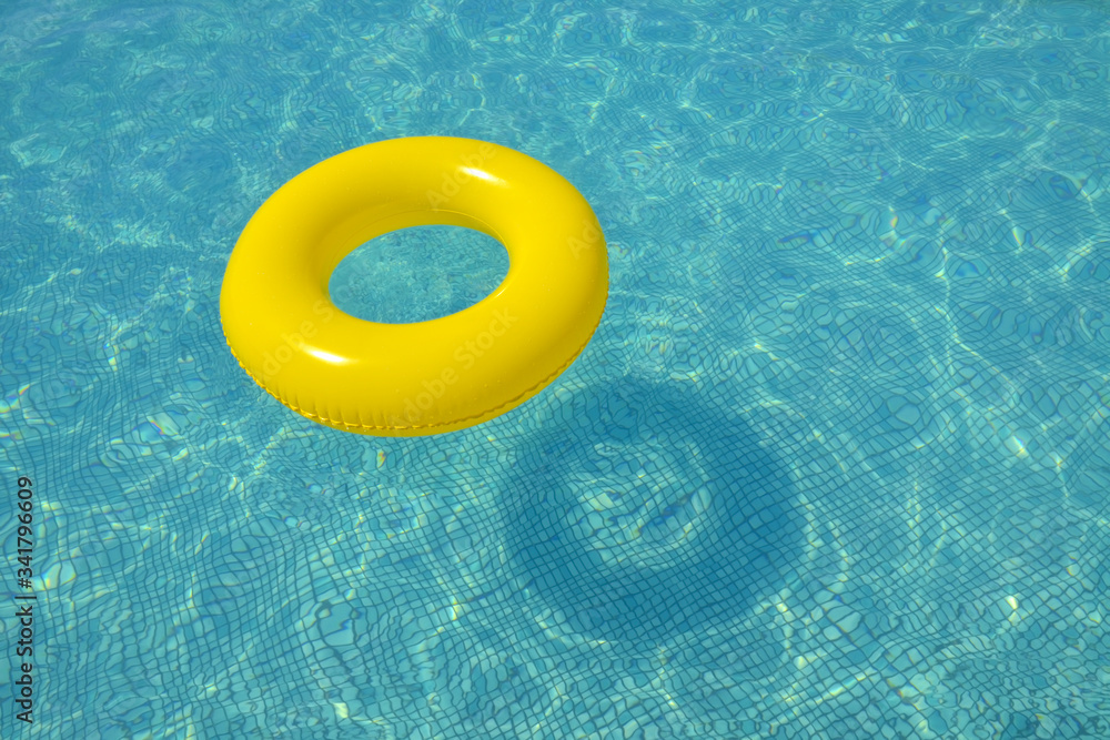 Colorful inflatable tube floating in swimming pool Stock Photo | Adobe ...