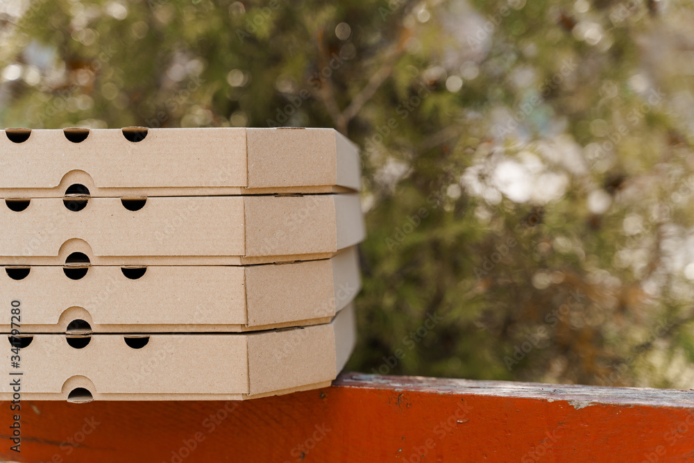 Promotion of 2+2 pizza boxes for food delivery. Isolated photo of 4 ...