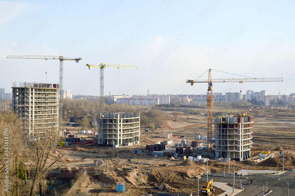 Top view of a large construction site with cranes and buildings houses ...