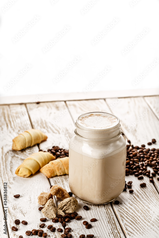 Authentic milkshake in a small jar with nice table presentation of ...