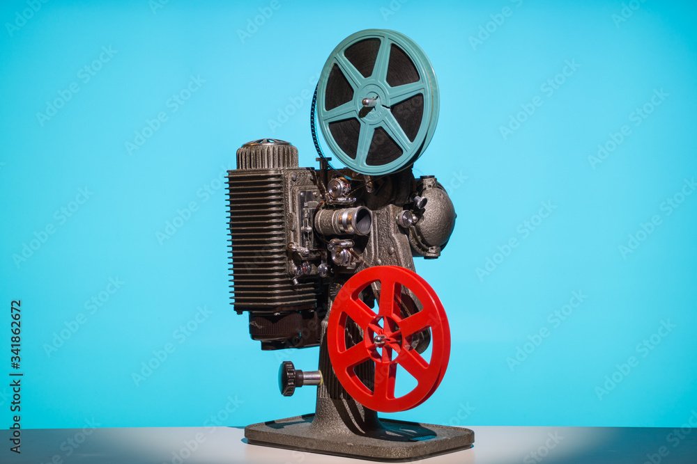 An authentic vintage 8mm film projector. With reels and film, set ...