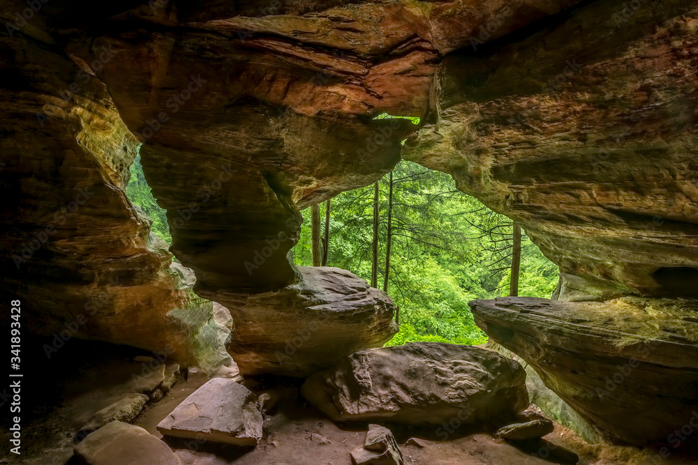 In Hocking Hills State Park, Ohio, Rock House is a twenty-five foot ...