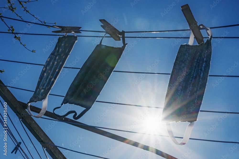 Homemade community face masks after washing to dry on the clothesline ...