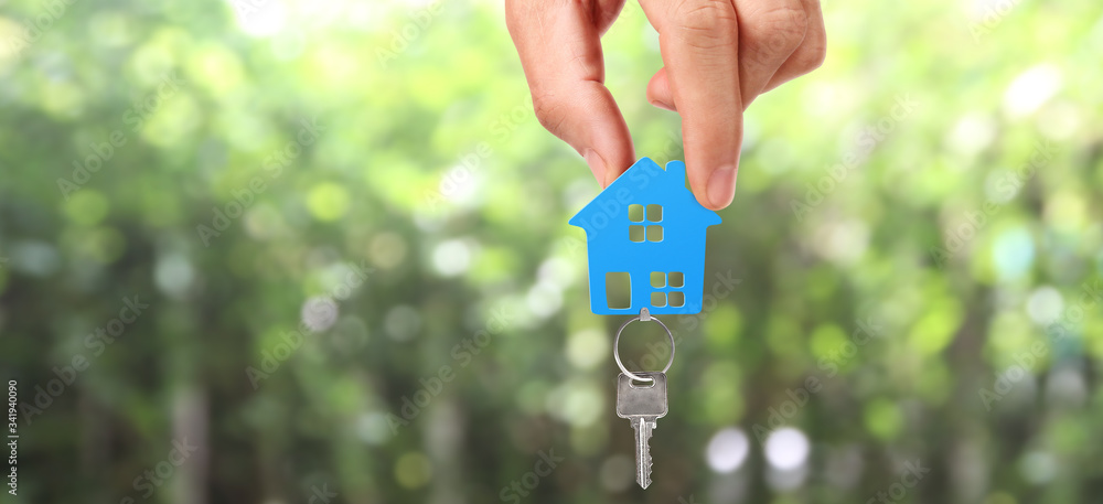 Real estate agent handing over house keys in hand Stock Photo | Adobe Stock