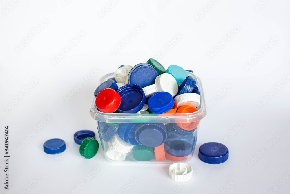 Lots of colorful plastic caps for bottles of various bottles in a ...
