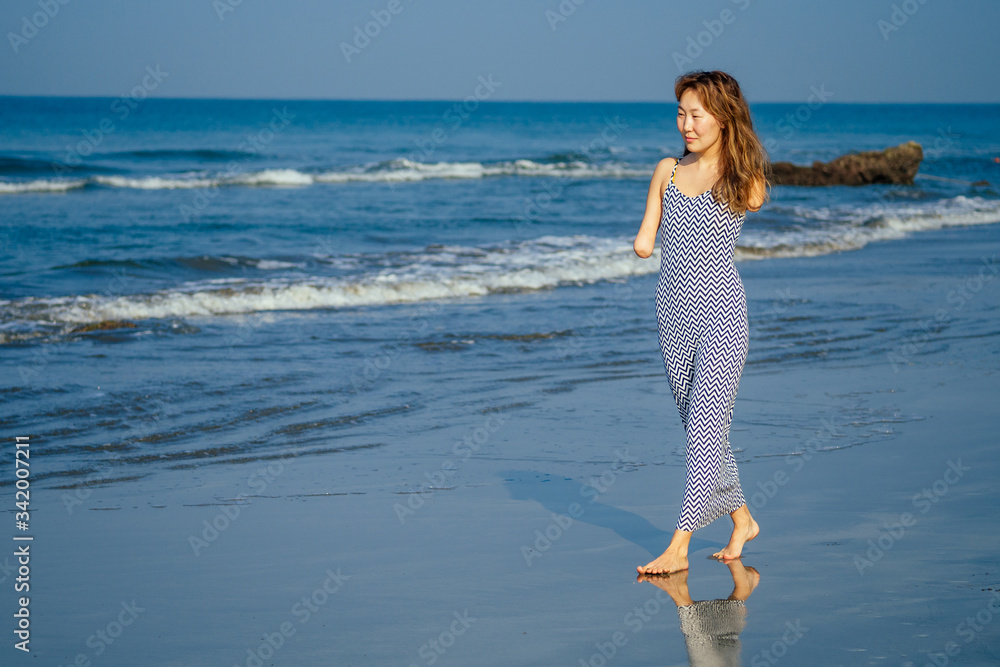 happy asian armless woman smilimg at the tropical beach Stock Photo ...