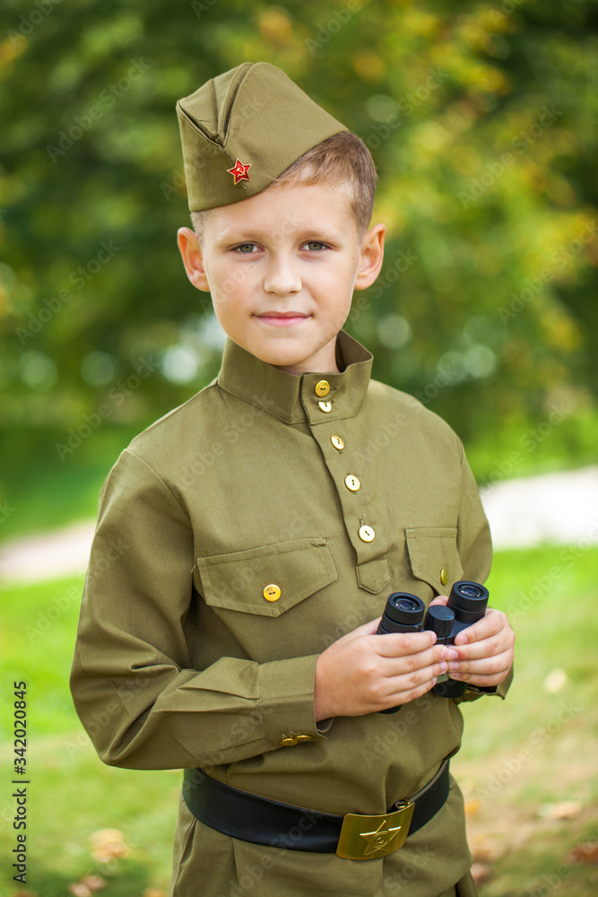 Young boy in military uniform of the Soviet army during the second ...