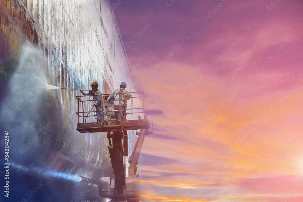 Shipyard Worker washing and cleaning in floating dry Dock worker steam ...