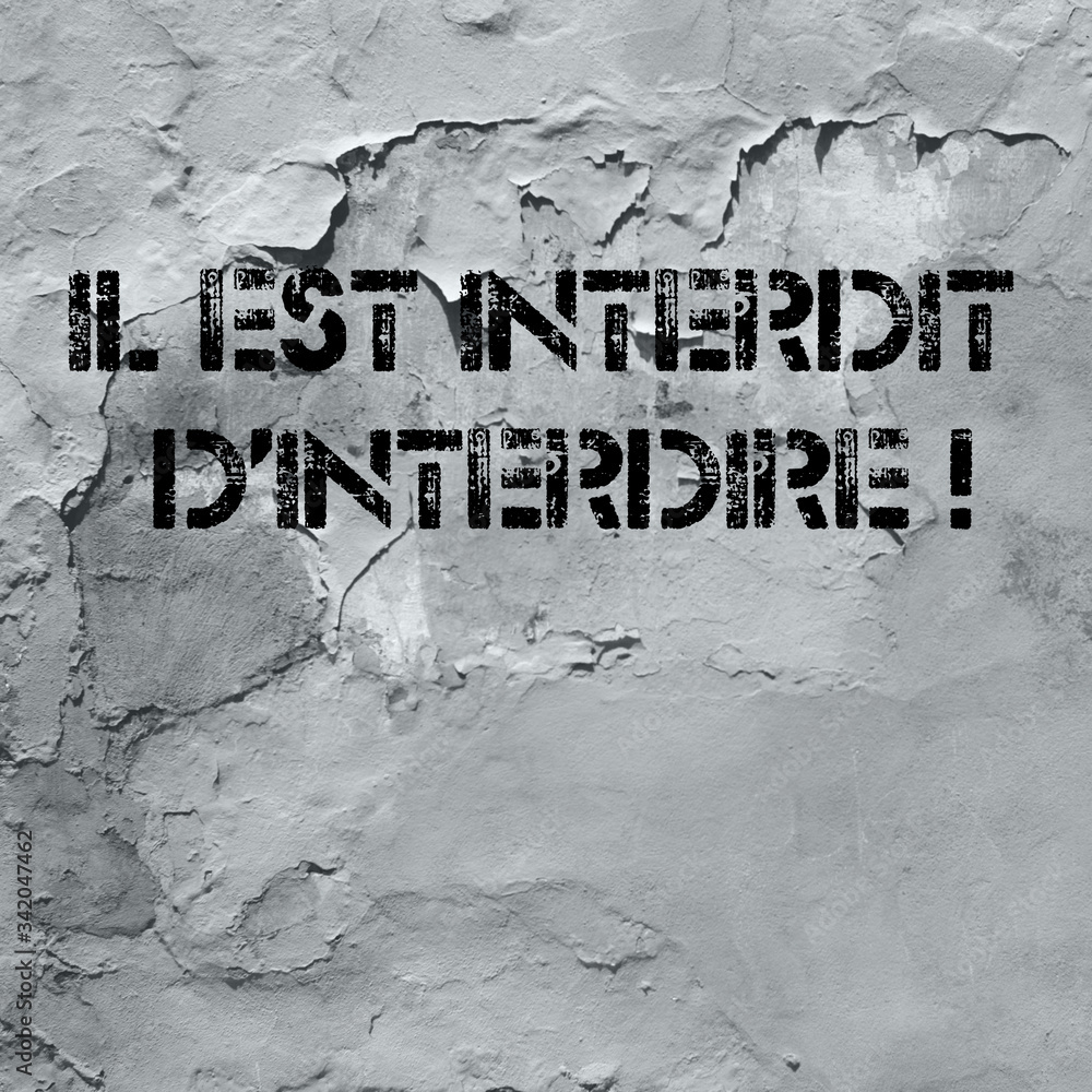 Wall with the French 1968 slogan "il est interdit d'interdire", meaning ...