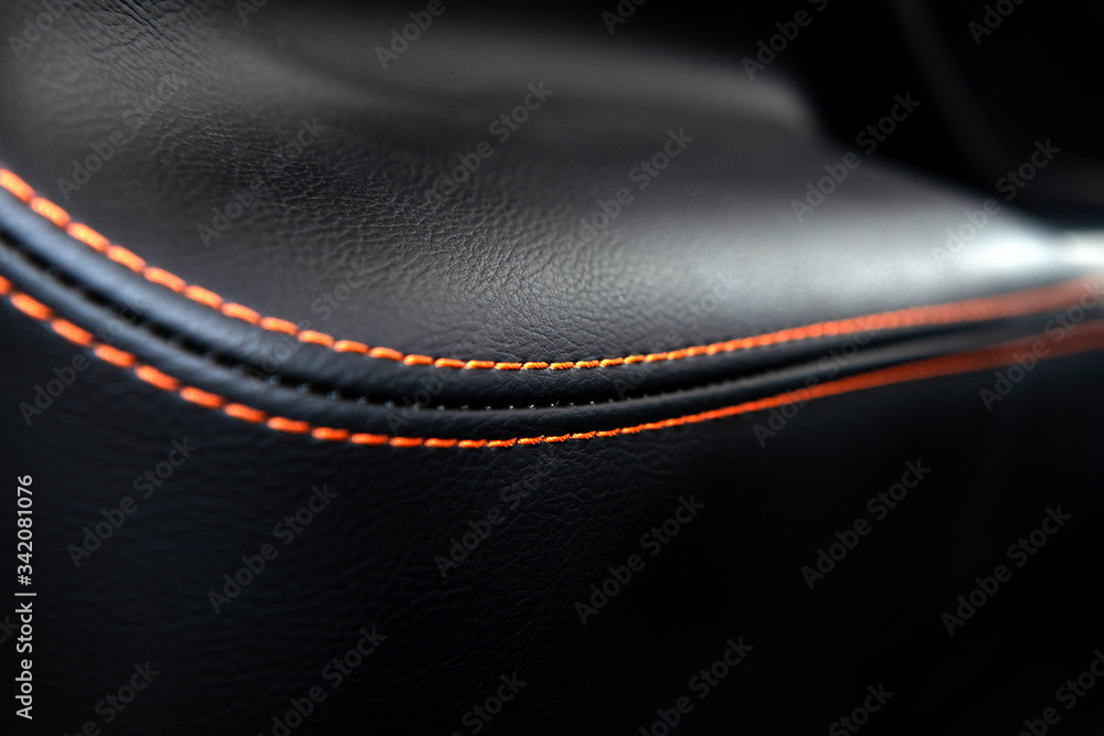 Detail of black and red line leather luxury car seat. Soft focus for ...