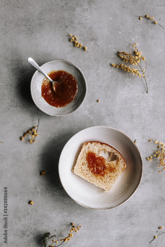 Top view of fresh slice of Brioche bread smeared with brown jam on ...