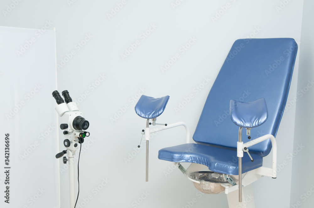 Gynecological chair and colposcope in the gynecological office Stock ...