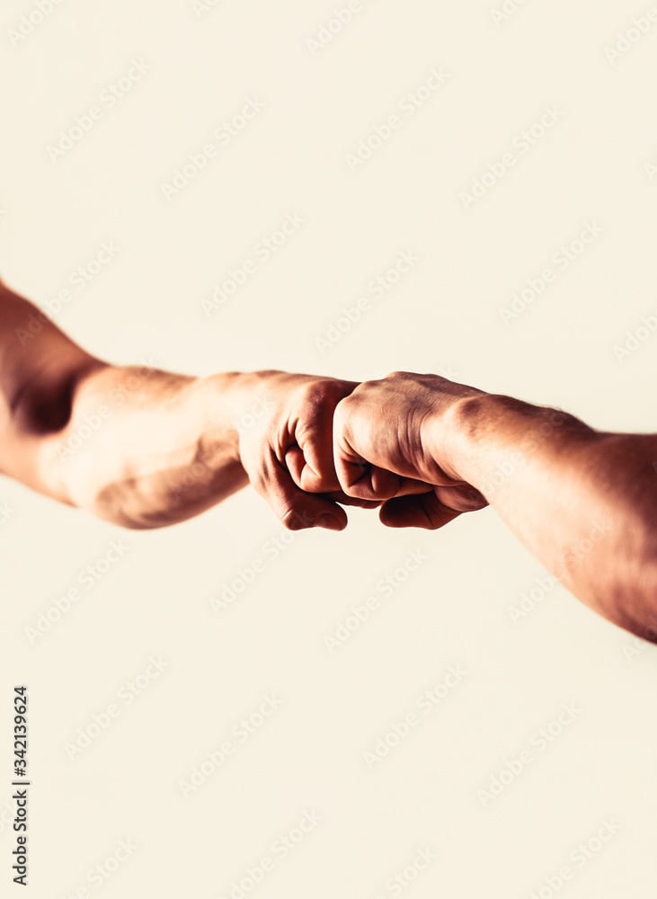 People bumping their fists together, arms. Friendly handshake, friends ...