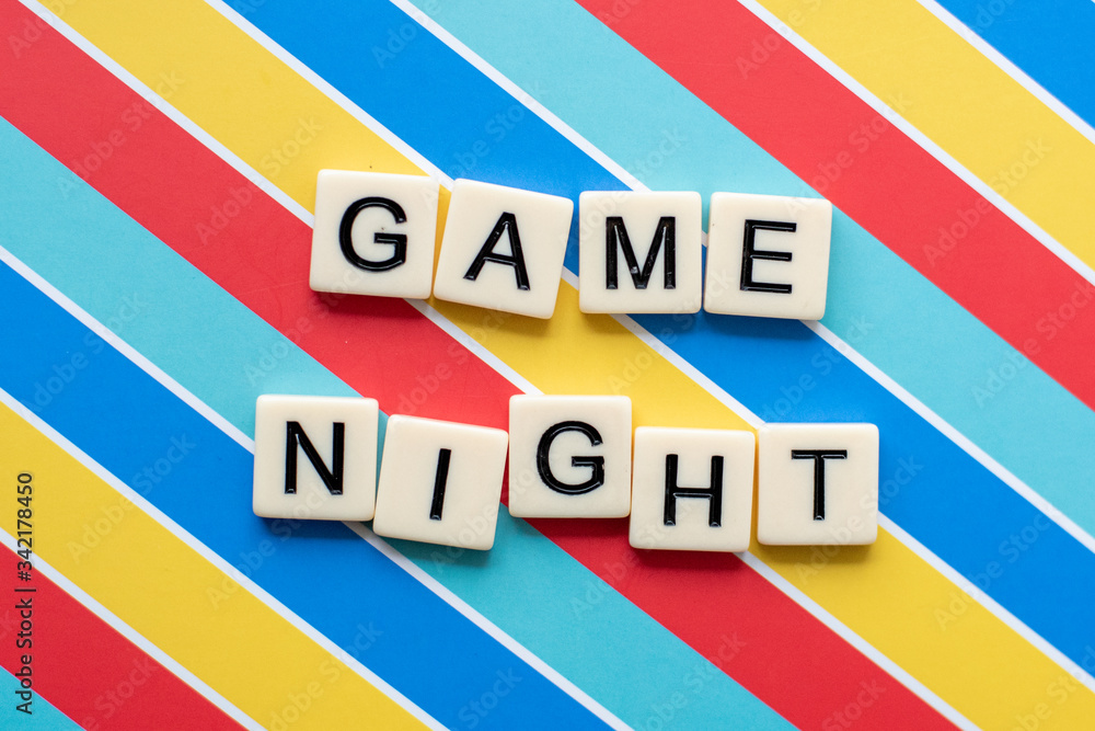 Game Night letter tiles on colorful background Stock Photo | Adobe Stock
