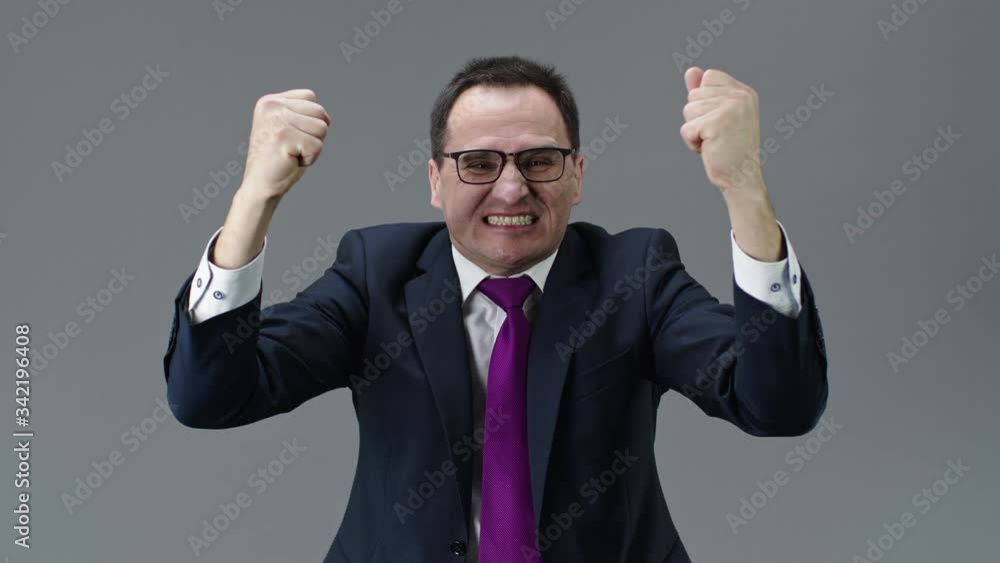 Furious, angry middle aged businessman in formal clothes, tie and ...