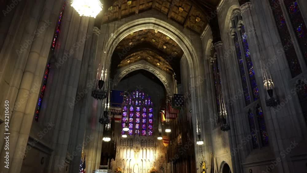 Cathedral interior with stained glass gothic windows, vaulted ceiling ...