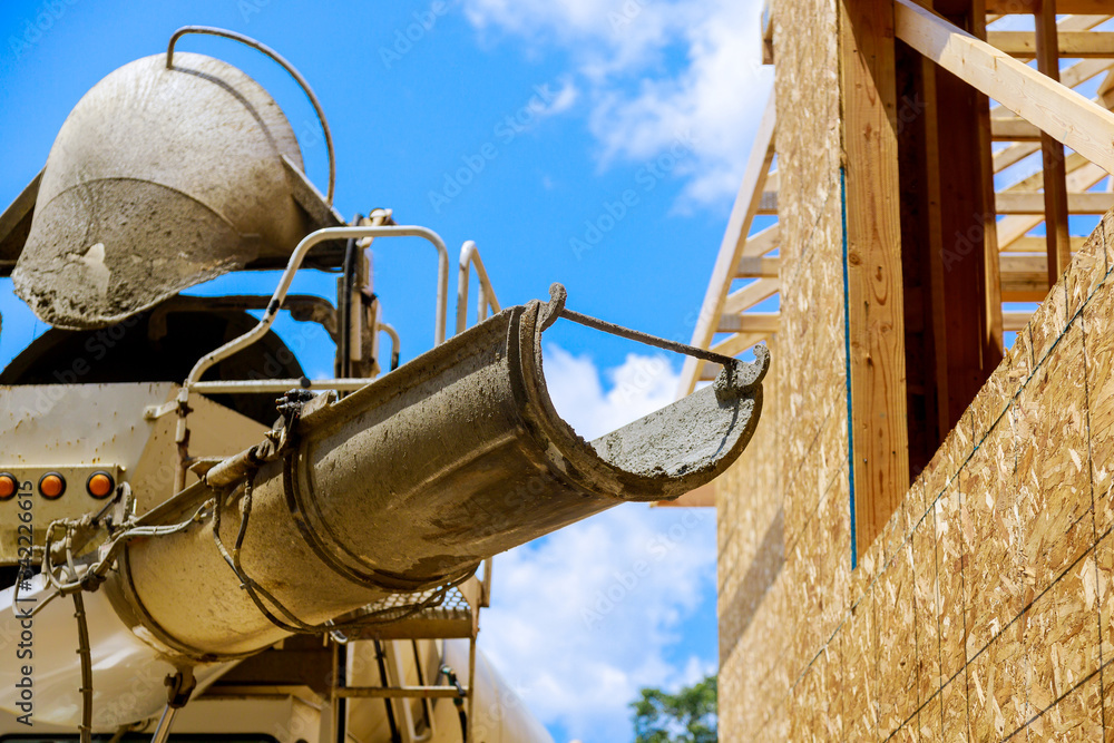 Mixer truck is cement to pouring fresh concrete into a foundation Stock ...