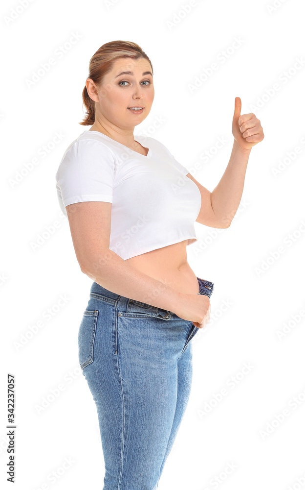 Overweight woman in loose clothes showing thumb-up on white background ...