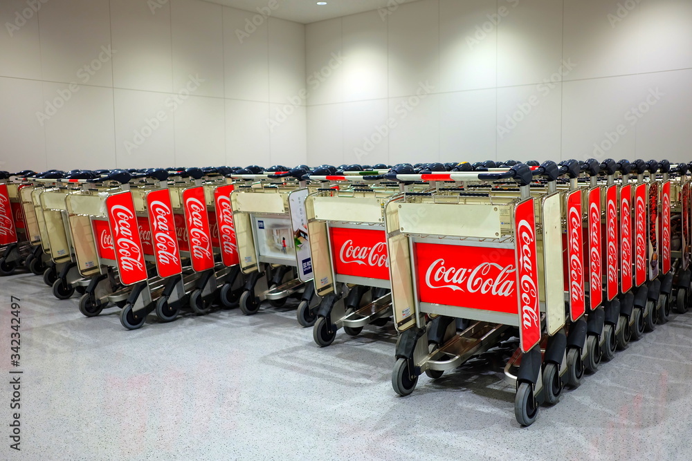 SAPPORO, JAPAN - NOVEMBER 09, 2019: Coca Cola Logo on Airport luggage ...