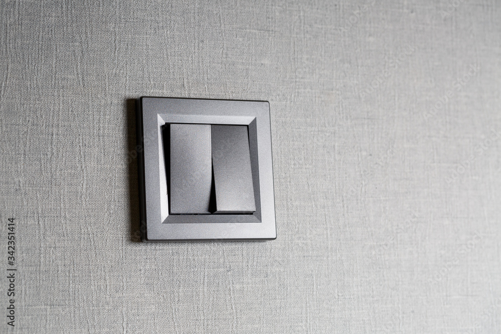 Two-key switch gray on the wall a plastic mechanical switch. Light ...