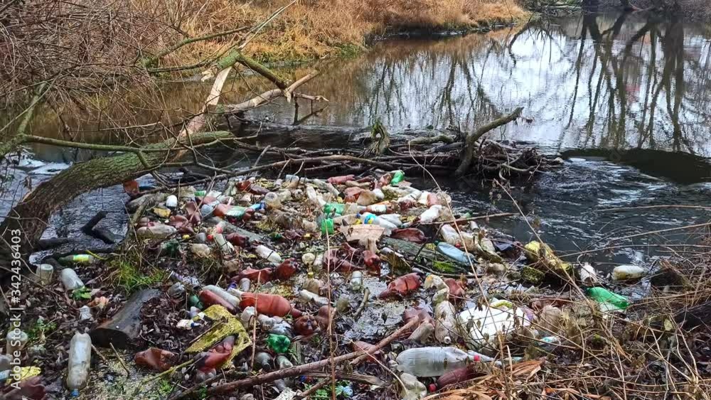 Plastic waste rubbish floating in river water. Environmental Pollution ...