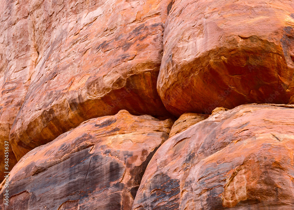 Rounded factured red rocks, close-up. Stock Photo | Adobe Stock