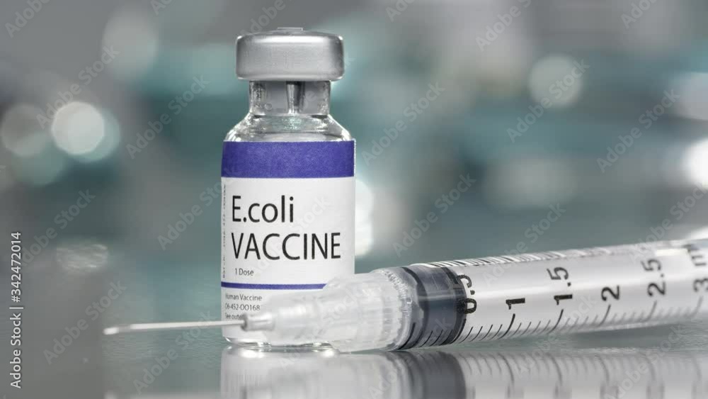 E.coli vaccine vial in medial lab with syringe place next to it slowly ...