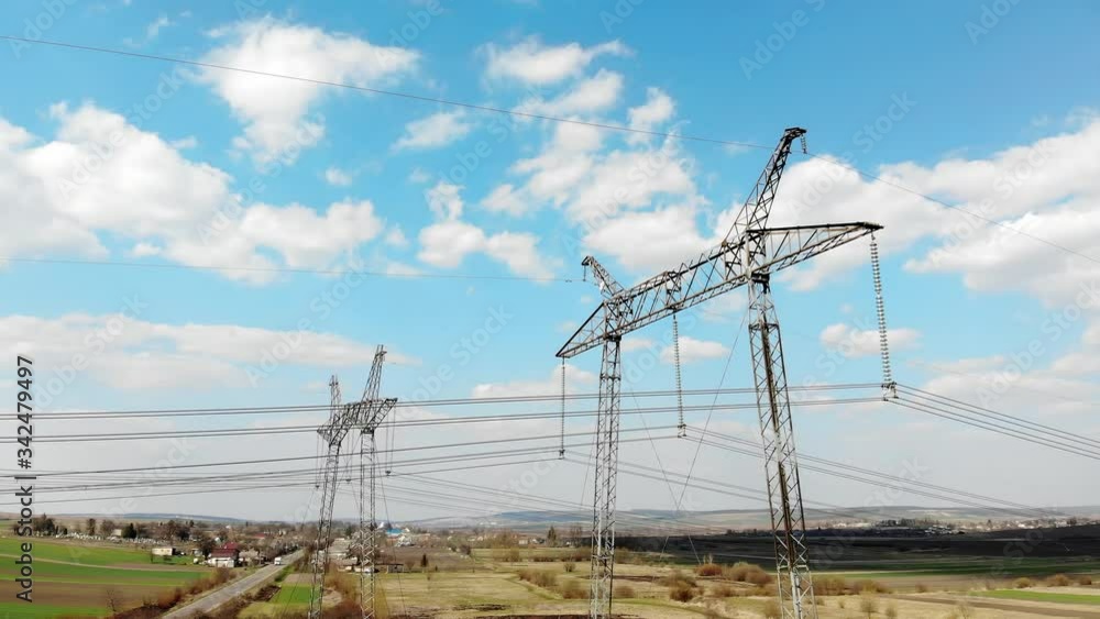 Aerial view Long-distance power transmission lines. High-voltage poles ...