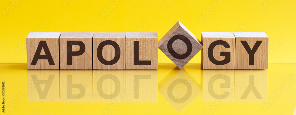 APOLOGY - word from wooden blocks with letters, sorry concept, yellow ...
