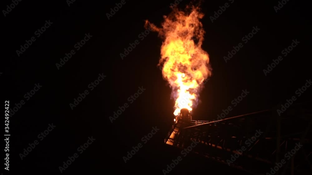 Oil and gas. Slow motion of gas flare from bottom burning at oil and ...