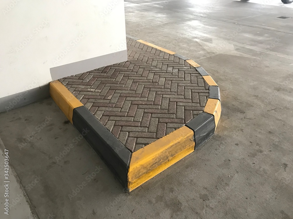 Interlock tile bricks and protected by Concrete kerb stones painted by ...