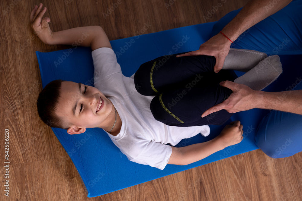 Foto de Little boy with scoliosis in rehabilitation clinic ...