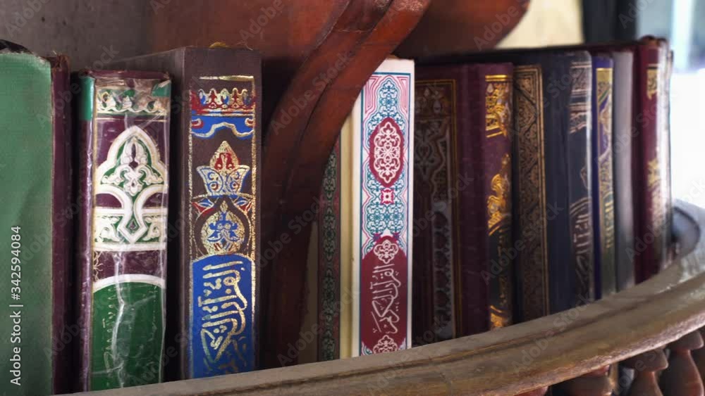 Row of Muslim Quran Islamic holy books lay in mosque for religious ...