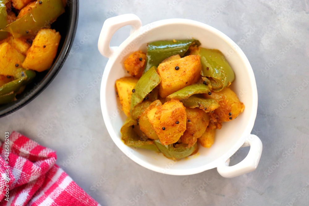 Indian food - Spicy Capsicum and potato stir fried with Indian spices ...