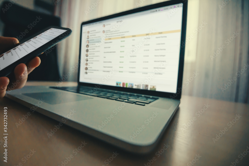 Laptop on the table at home. On screen chart in messenger, background ...