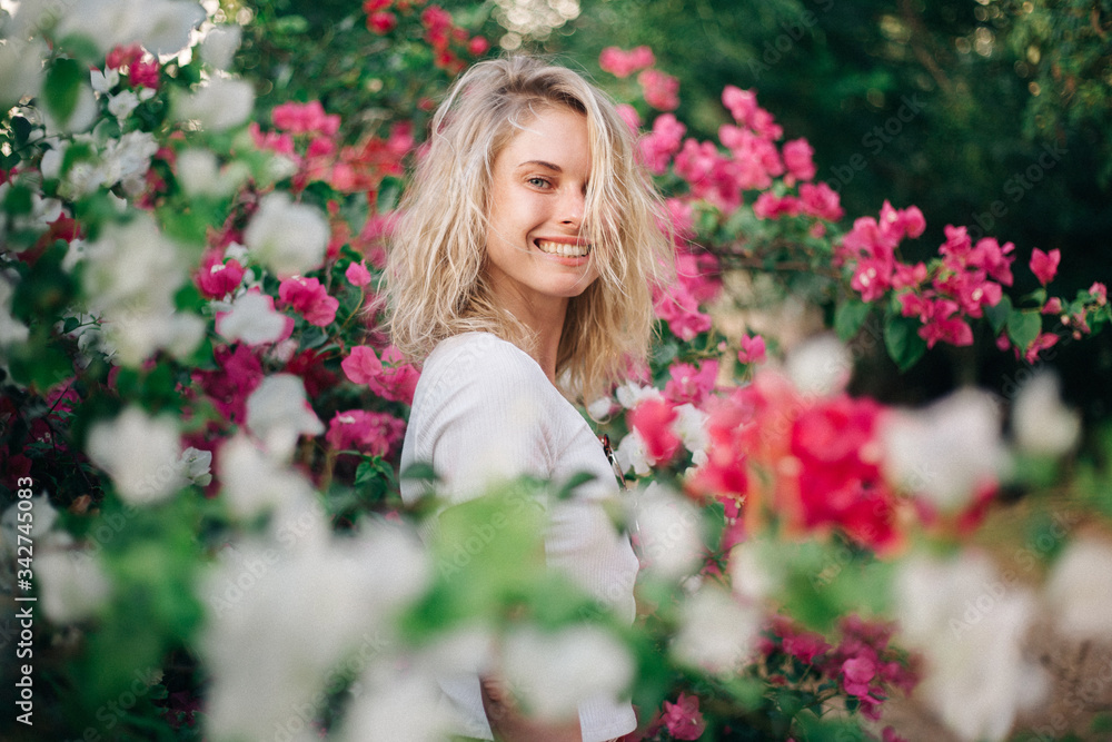 Young pretty fashion sport woman posing outdoor in summer on tropic ...