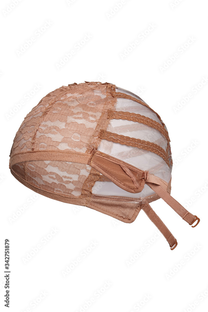 Subject shot of a light-brown lace wig cap with flower tracery, clear ...