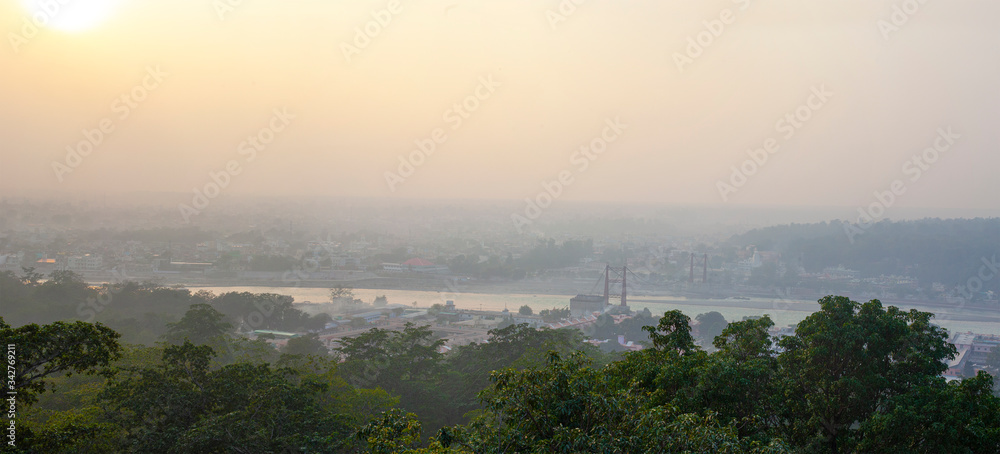 Sunset view of Rishikesh, with Ram Jhula bridge , India Stock Photo ...
