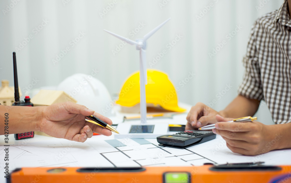 Engineers consult for wind turbine power plant project planning. Stock ...