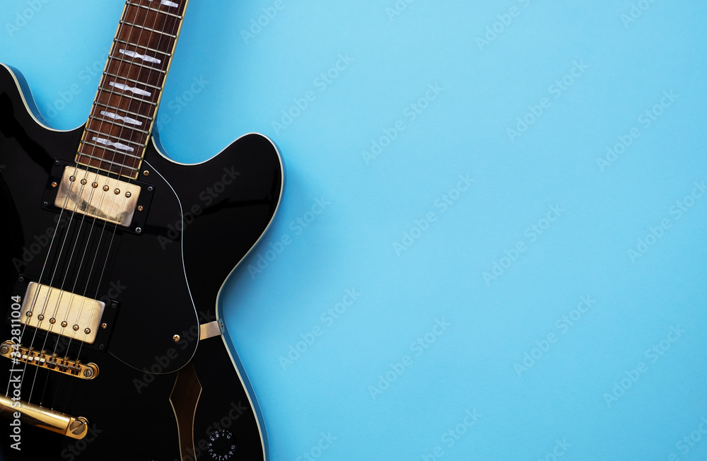 Electric guitar on a blue background Stock Photo | Adobe Stock