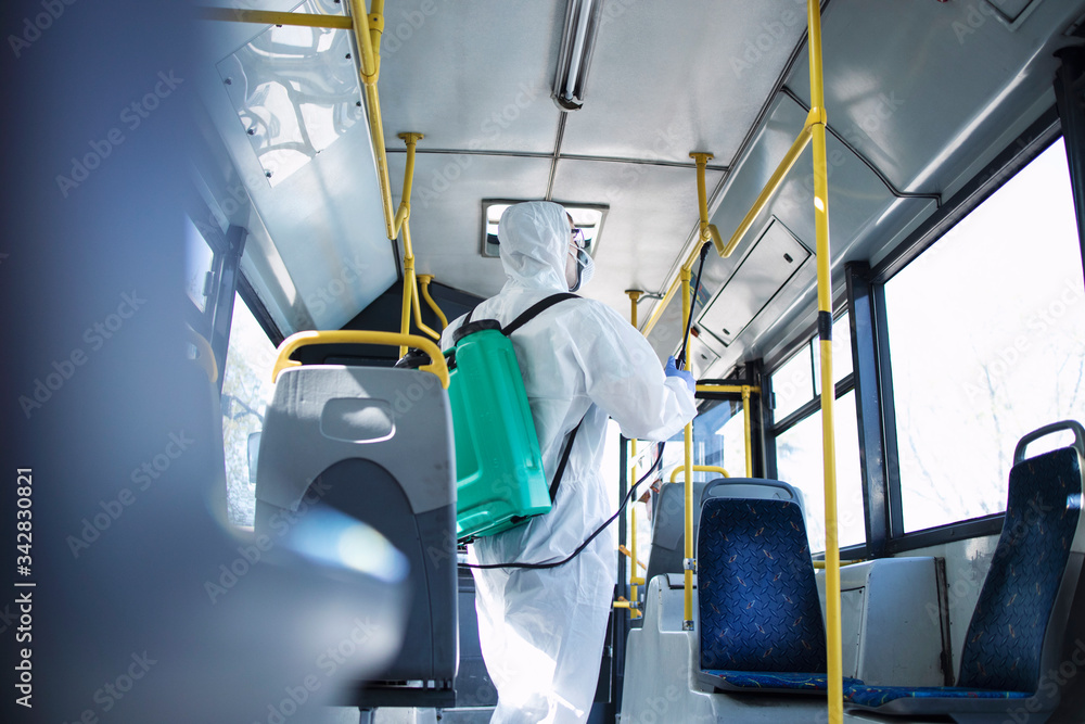 Foto de Public transportation healthcare. Man in white protection suit ...