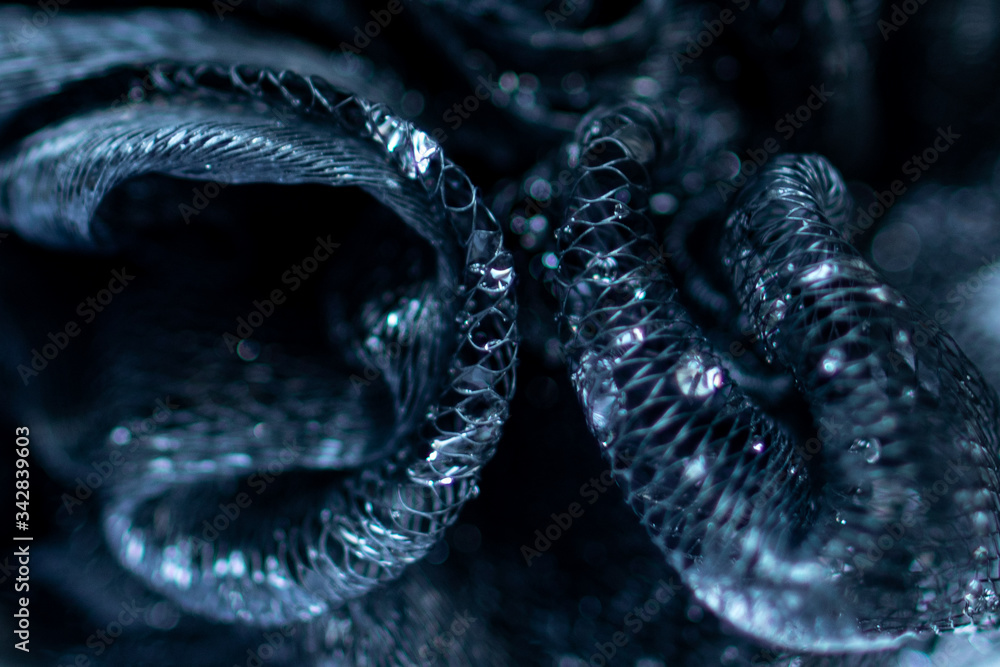 Background and backsplash of wet net with moist crystal water drops ...