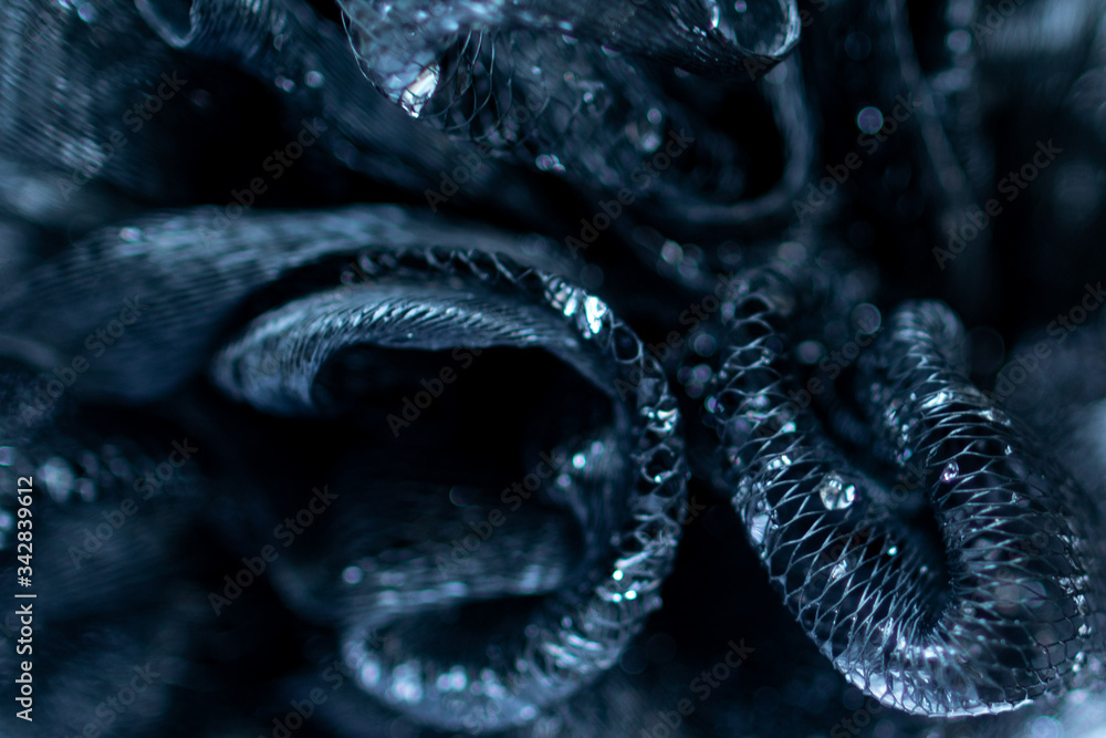 Background and backsplash of wet net with moist crystal water drops ...