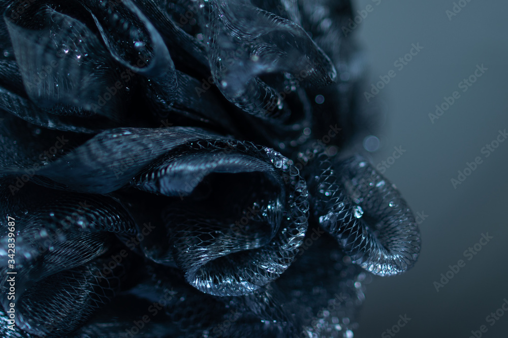 Background and backsplash of wet net with moist crystal water drops ...