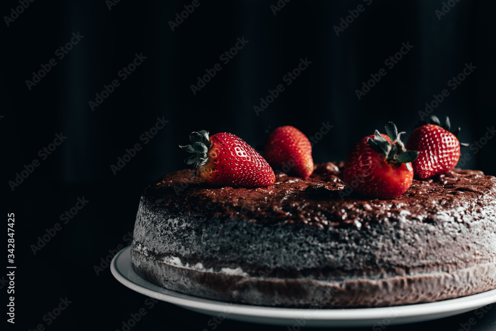 Chocolate cake with strawberries tasty homemade cake on table side view ...