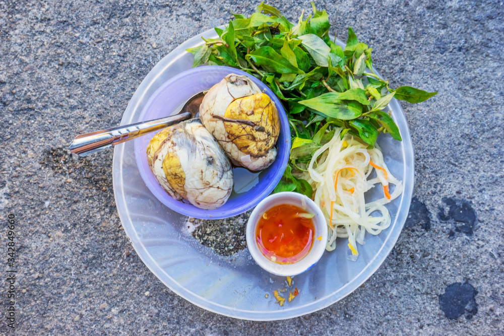 Balut (boiled developing duck embryo) in Hoi An, Vietnam. This is a ...