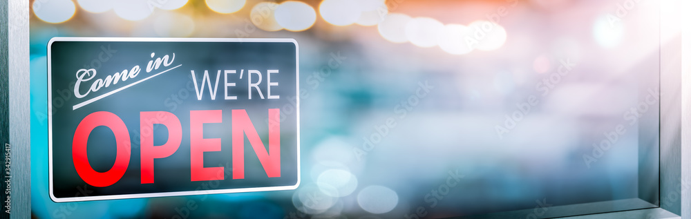 Small Business Store Front With "Come In We're Open" Sign Hanging On ...