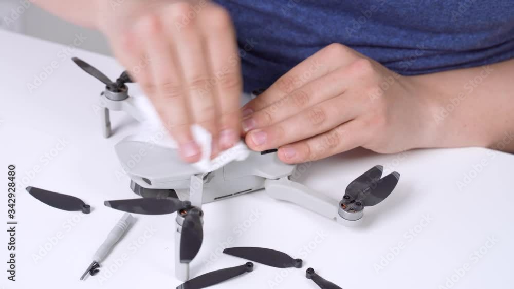 Human hands wipe drone blades with sterile paper towel with cleaning ...